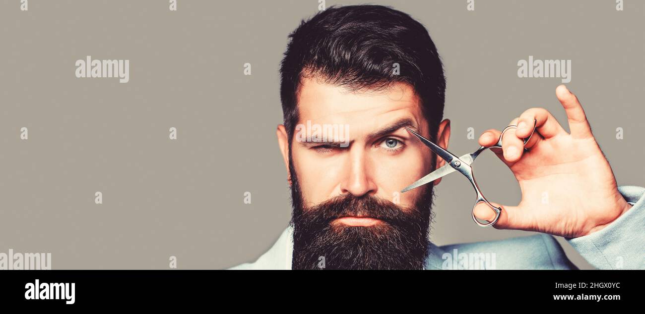 Barber scissors, barber shop. Brutal man, moustache. Male in barbershop ...