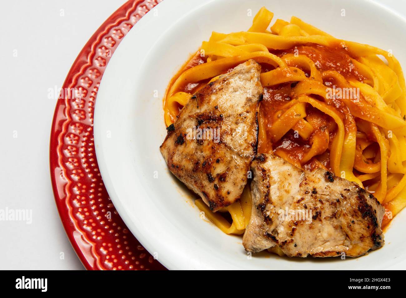 spaghetti dish with red sauce and chicken, brazilian cuisine Stock ...
