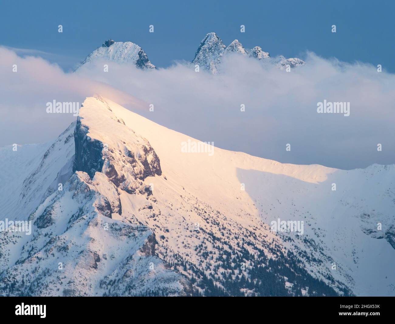 Winter landscape of the Tatra Mountains. View of the snow-capped peaks ...