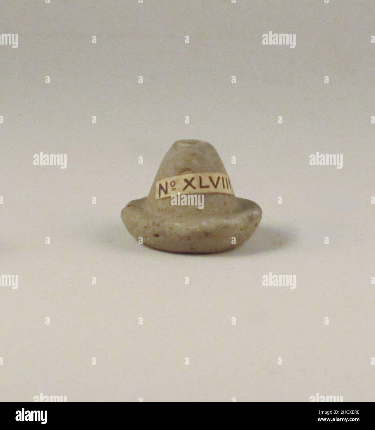 Clay object Conical, shaped like a hat with high crown and rolled brim ...