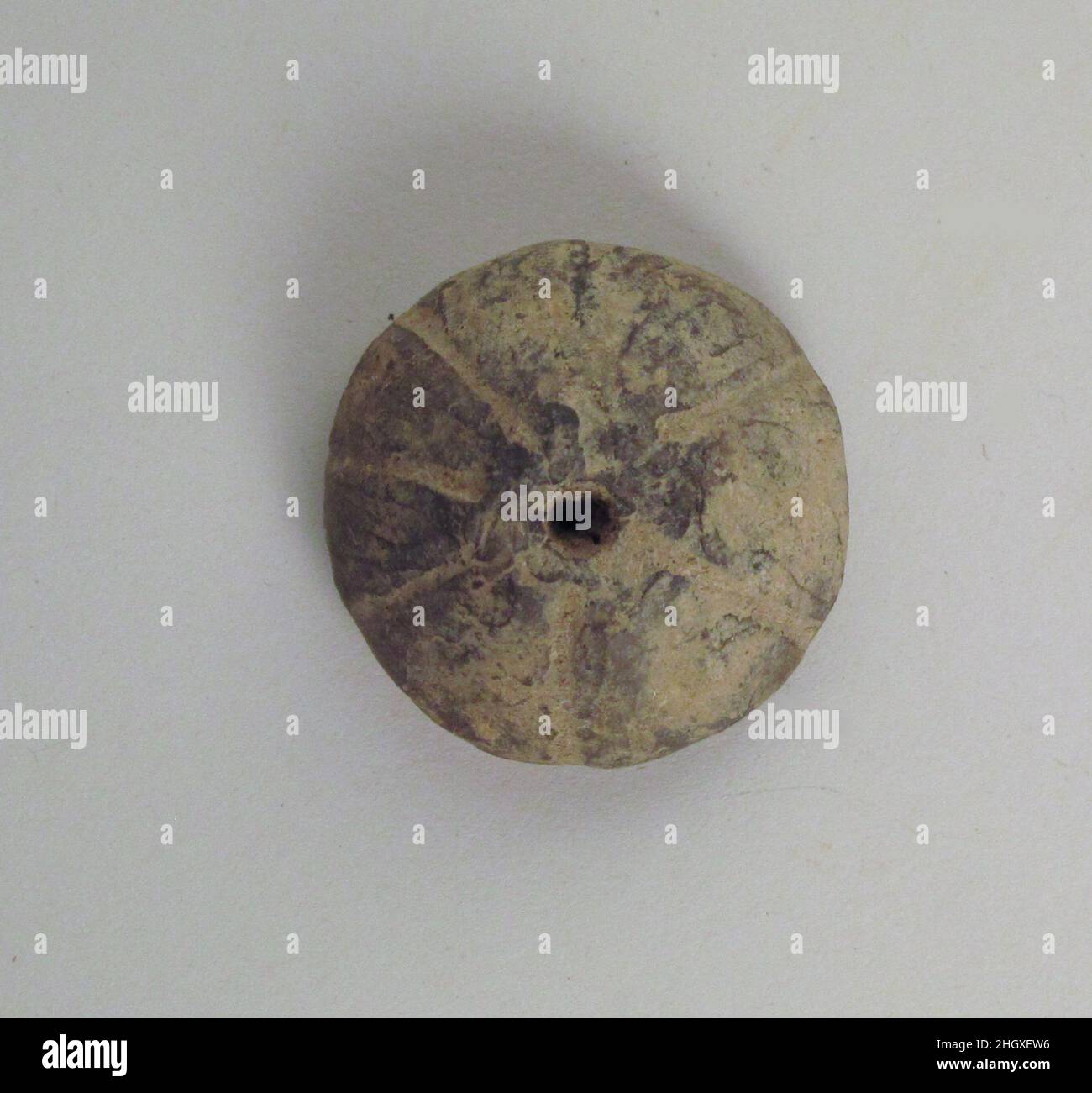 Roundel, disk Conical object with hole through it perpendicularly, and ...