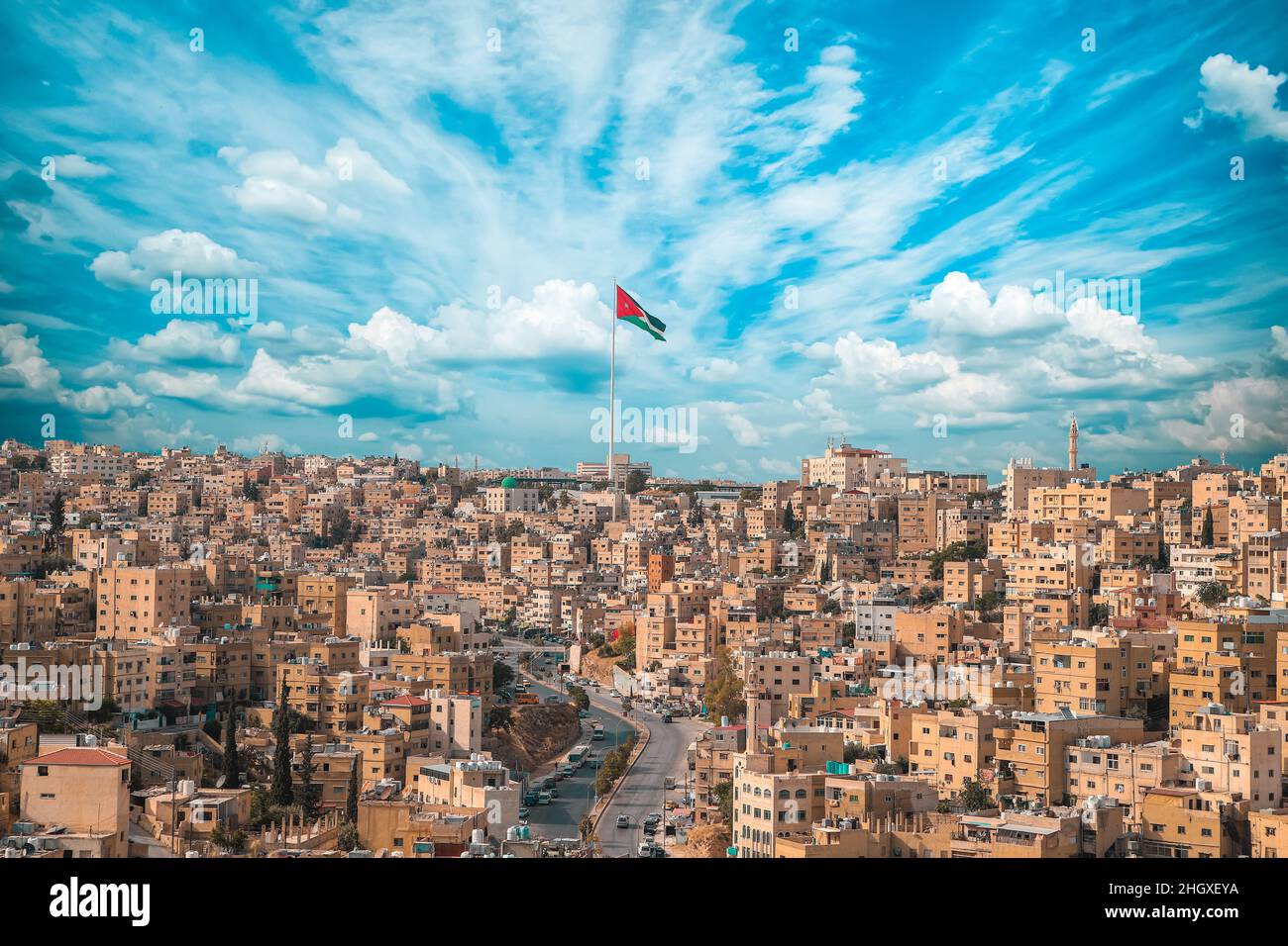 Jordan flag in Amman, landscape view of cloudy sky background at the ...