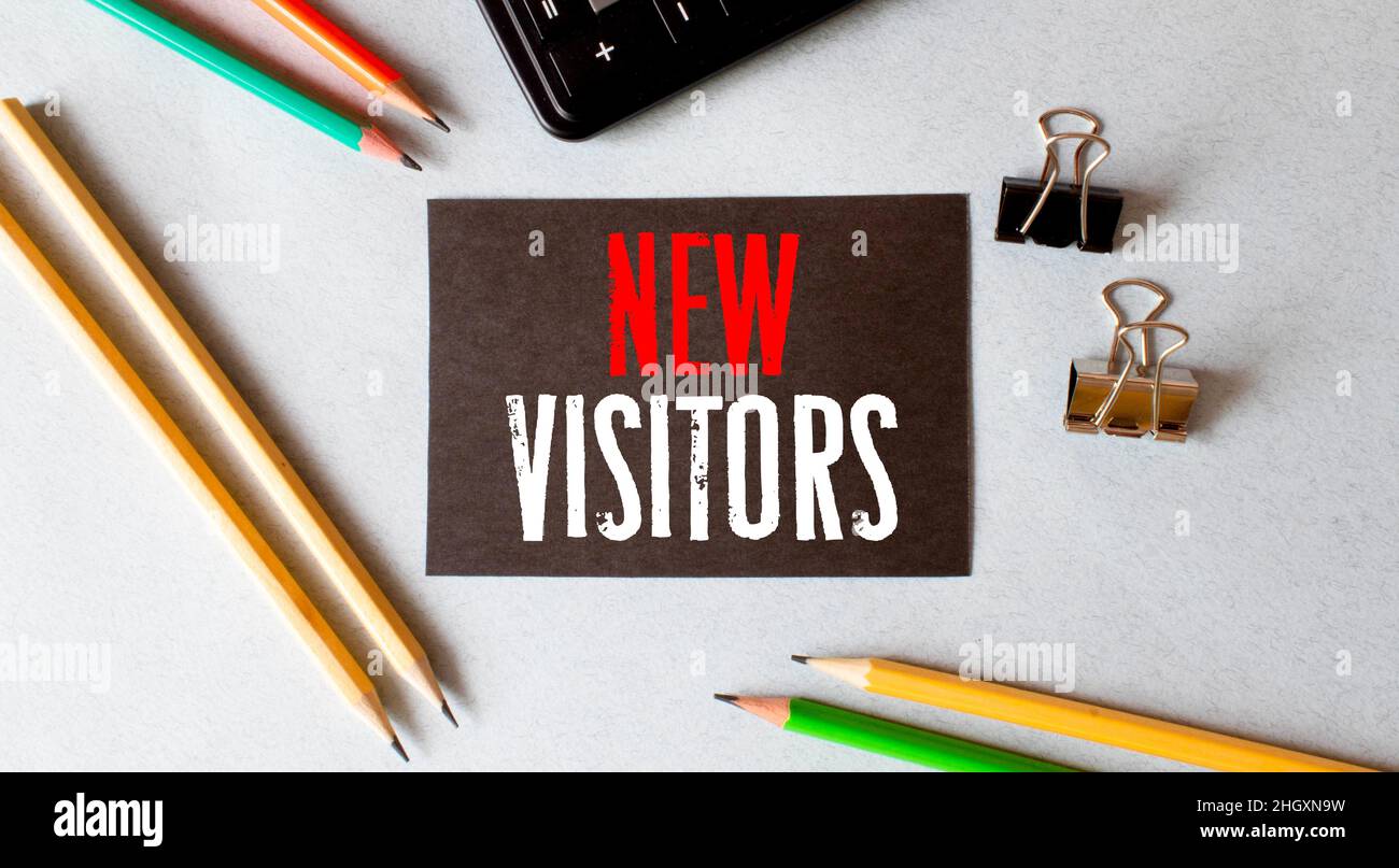 text New Visitors on white paper Stock Photo - Alamy