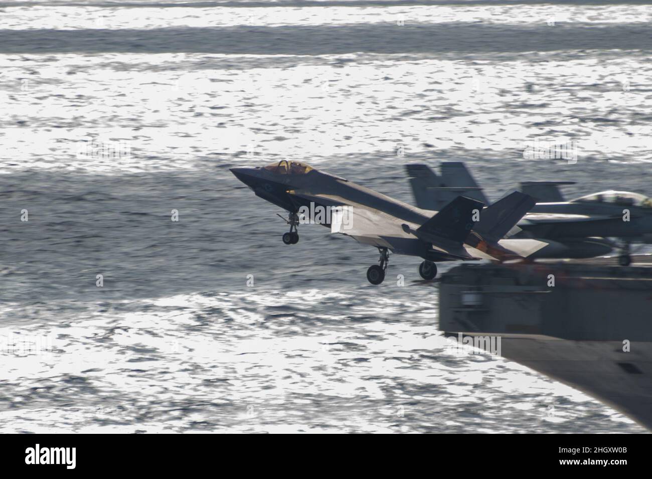 220122-N-EE352-1359 PHILIPPINE SEA (Jan. 22, 2022) An F-35C Lightning II, assigned to the “Black ...