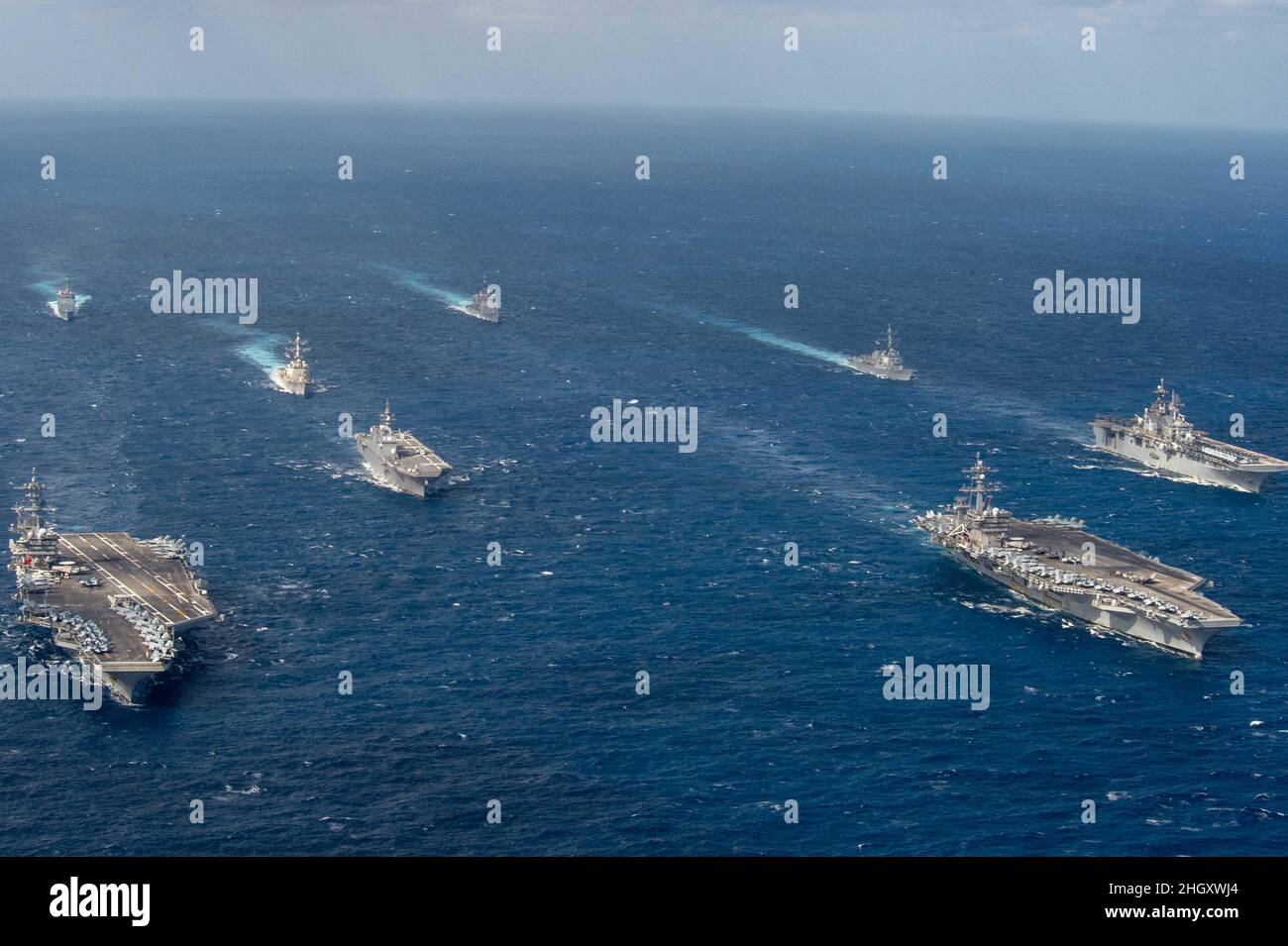 220122-N-PQ495-1304 PHILIPPINE SEA (Jan. 22, 2022) From right, America ...