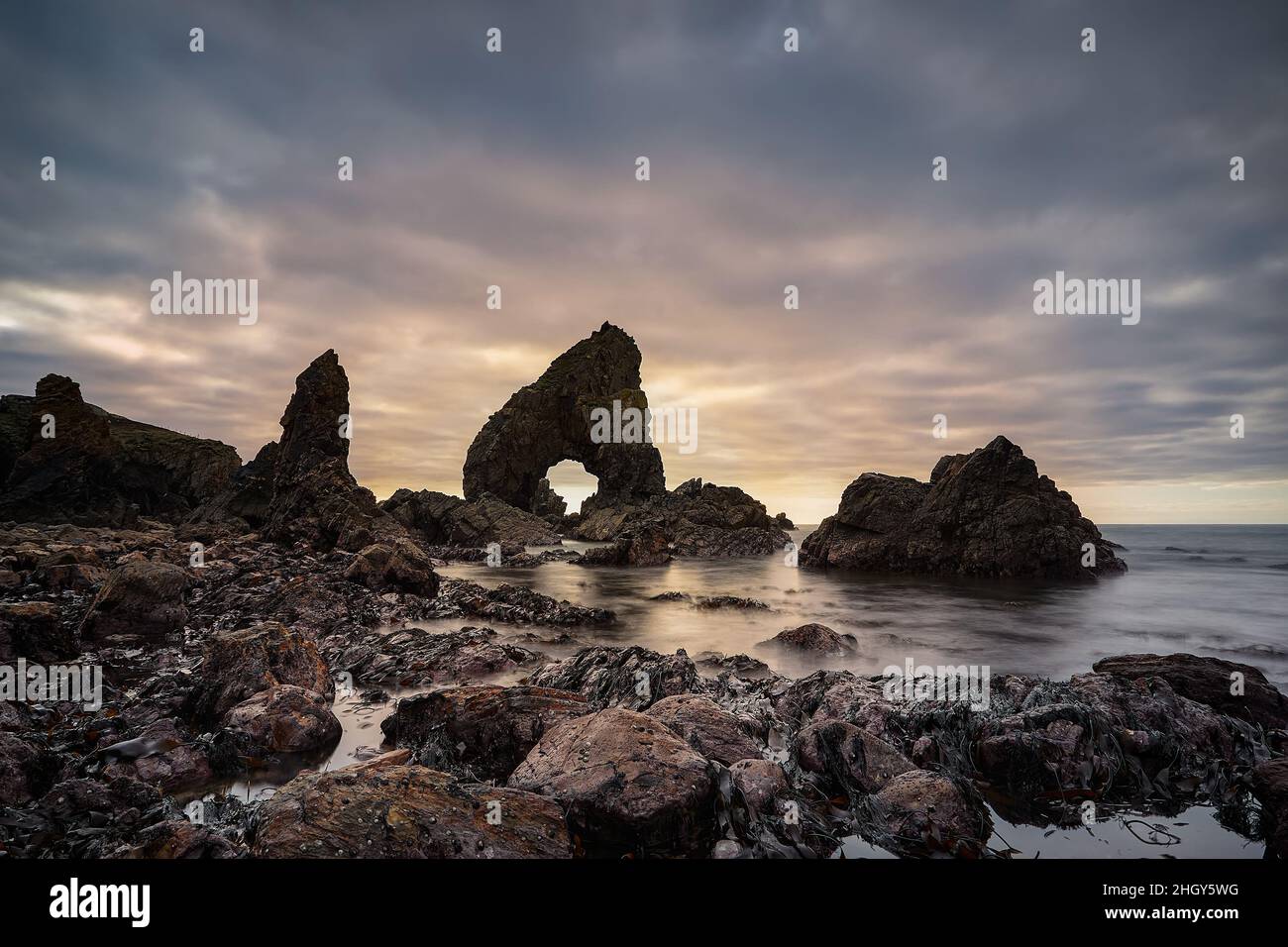 This sea arch is known as The Breeches and is located at Crohy Head on ...