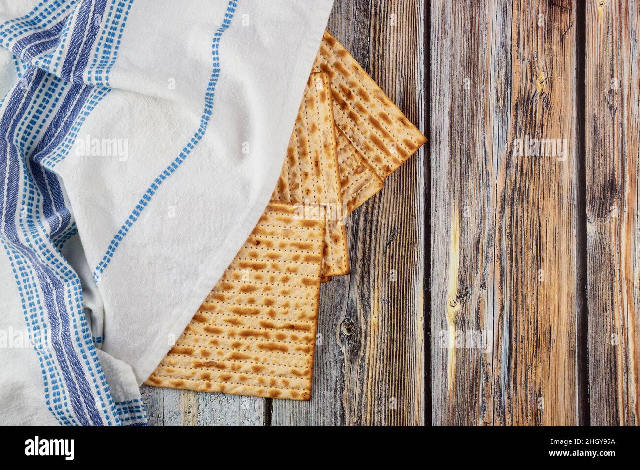 Jewish matzah bread with tallit on wooden rustic background. Passover ...