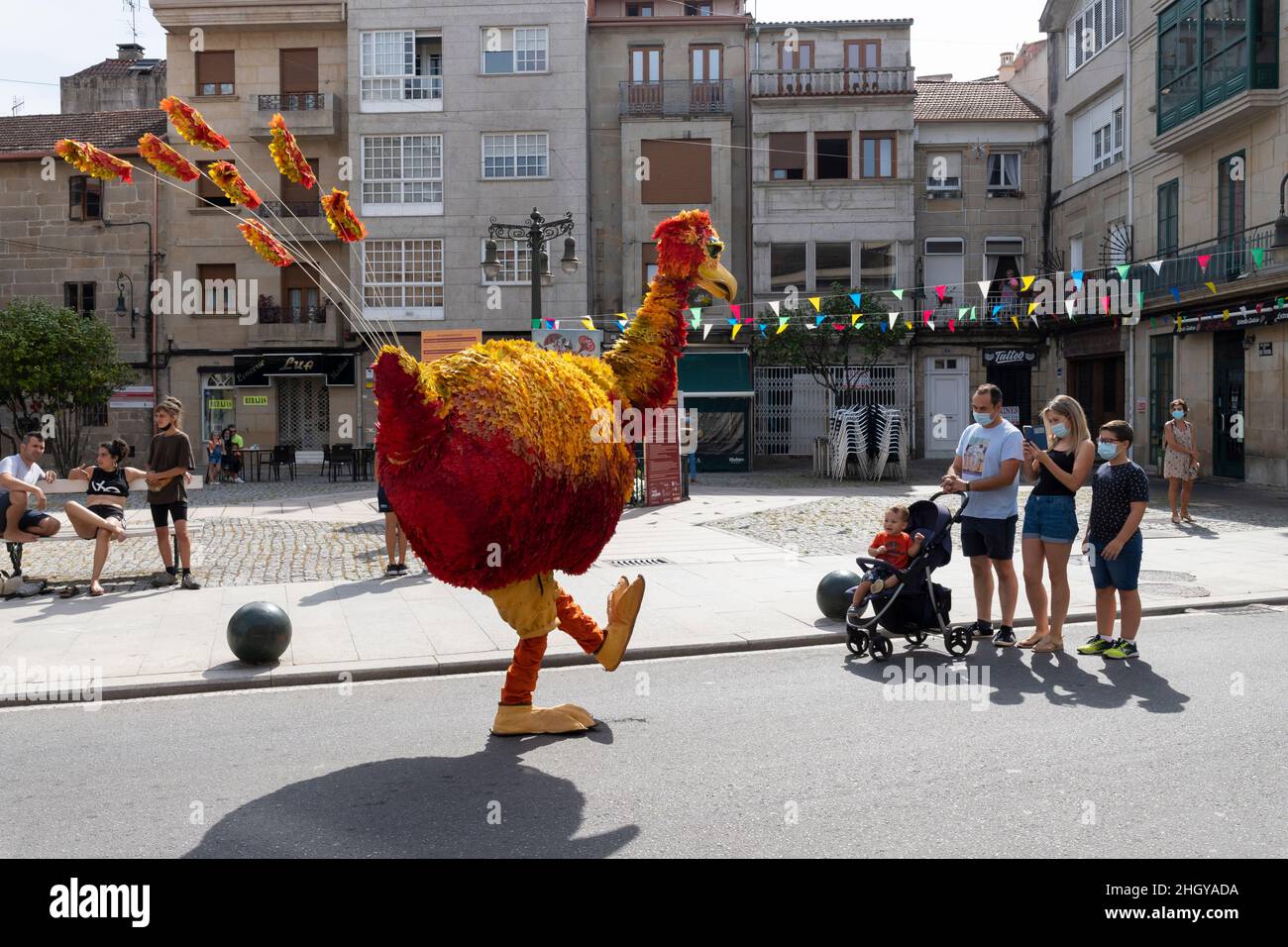 A performers entertains a family at the 22nd Annual International ...