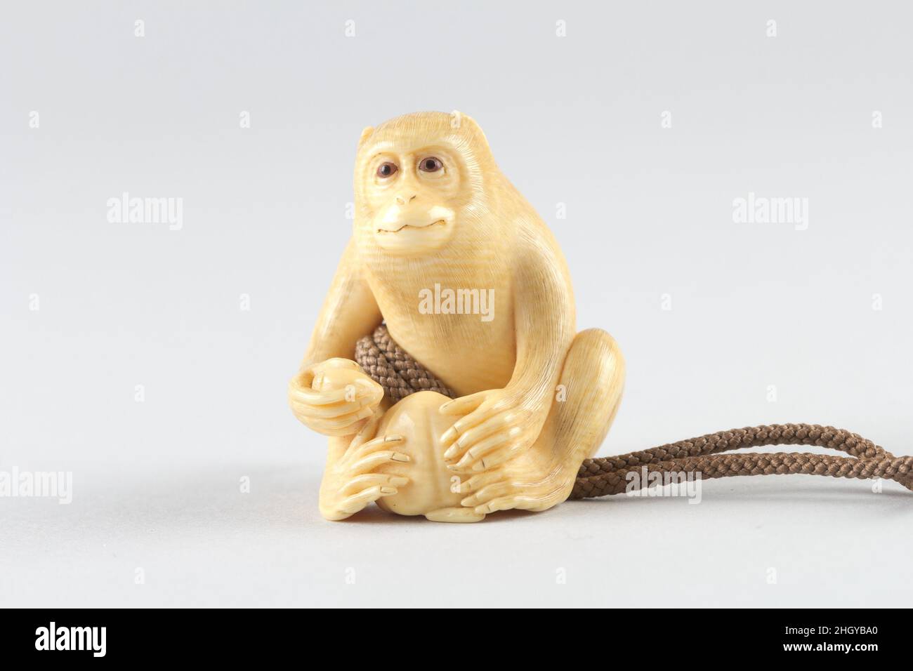 Netsuke of Seated Monkey with Persimmon 19th century Japan. Netsuke of ...