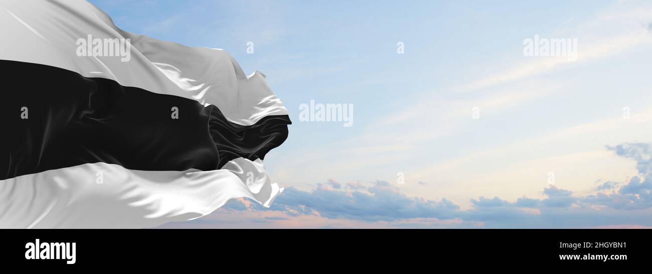 flag of Delft , Netherlands at cloudy sky background on sunset ...