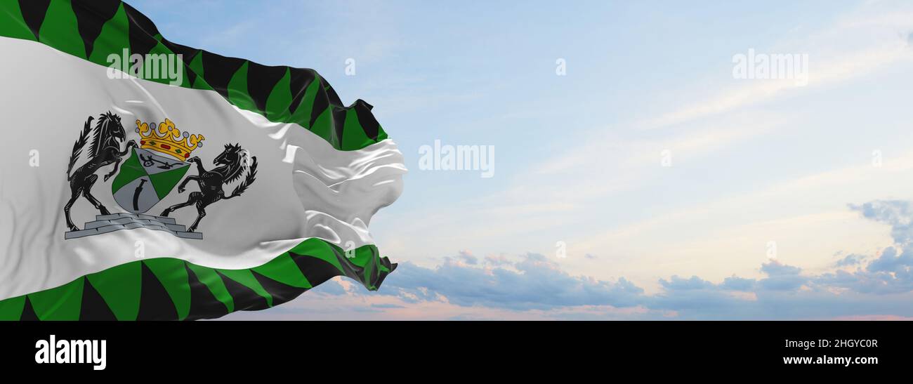flag of Emmen , Netherlands at cloudy sky background on sunset ...