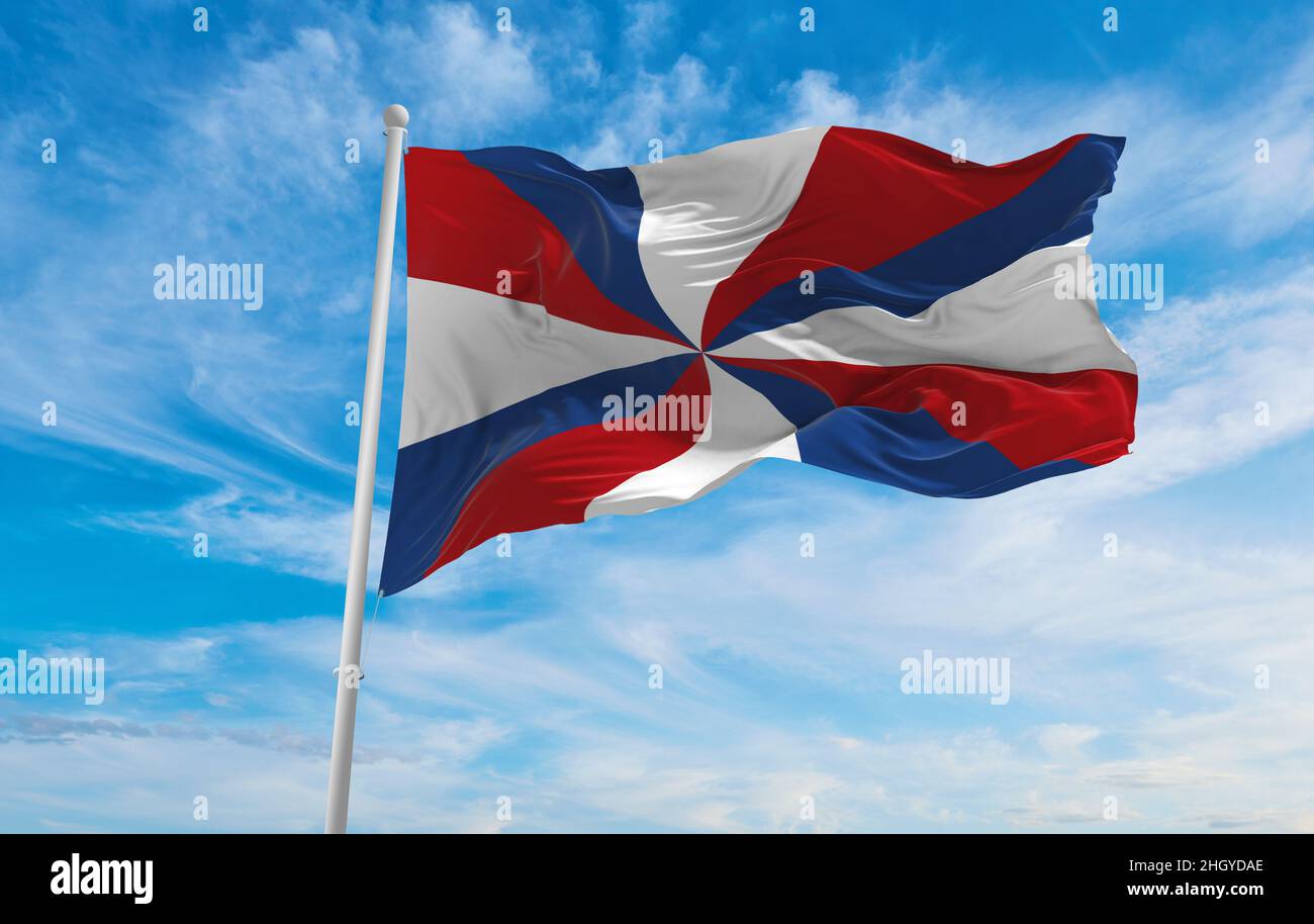 flag of Naval Jack , Netherlands at cloudy sky background on sunset ...