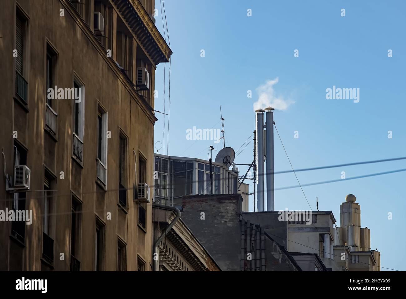 Bucharest, Romania - January 05, 2022: Smoke chimneys are seen on a ...