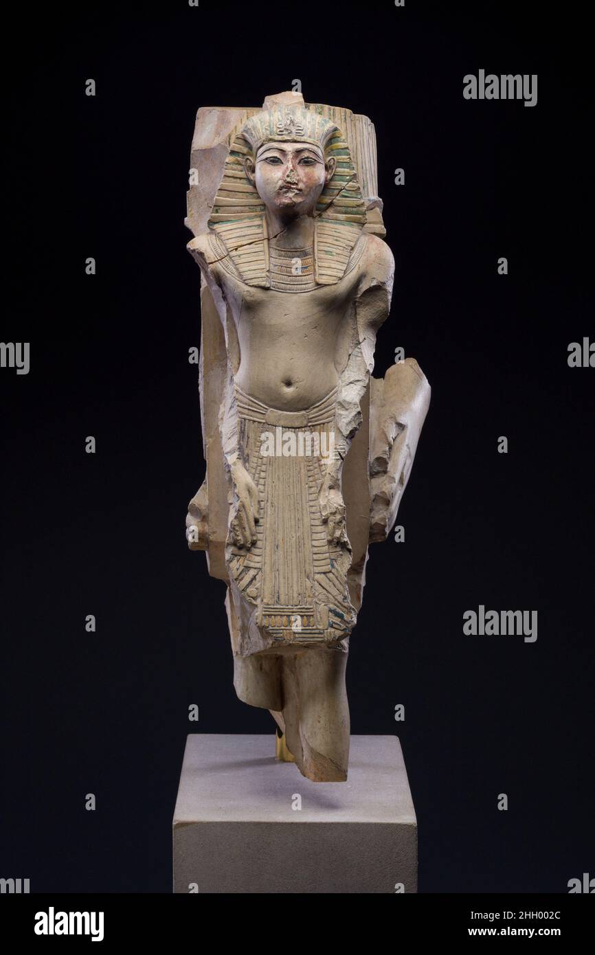 Figure of a king as part of a group proffered by an official of ...