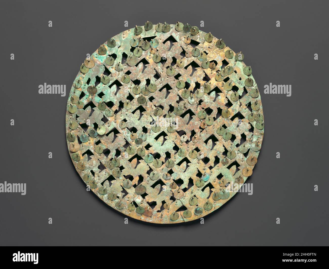 Disk Ornament 6th–7th century Moche (Loma Negra) This gilded copper ...