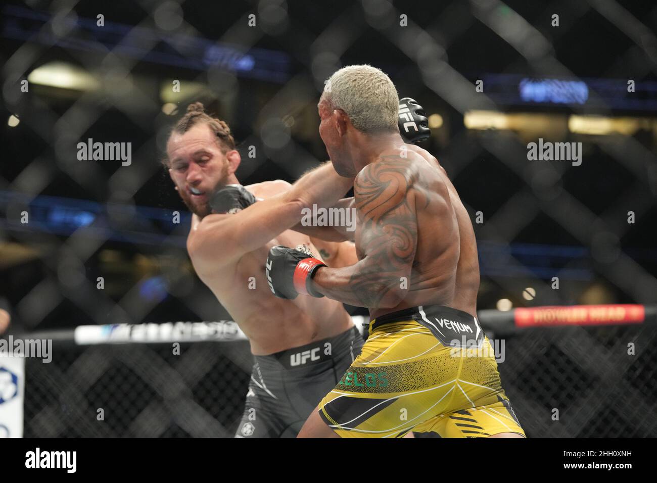 ANAHEIM, CA - JANUARY 22: (R-L) Raoni Barcelos punches Victor Henry in ...