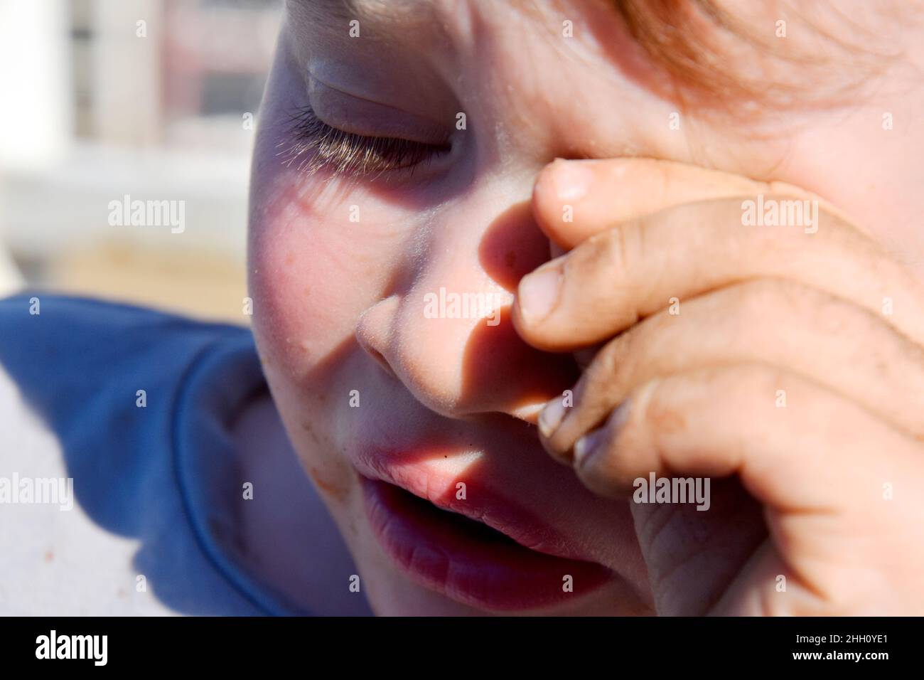 Child rubbing his eyes hi-res stock photography and images - Alamy