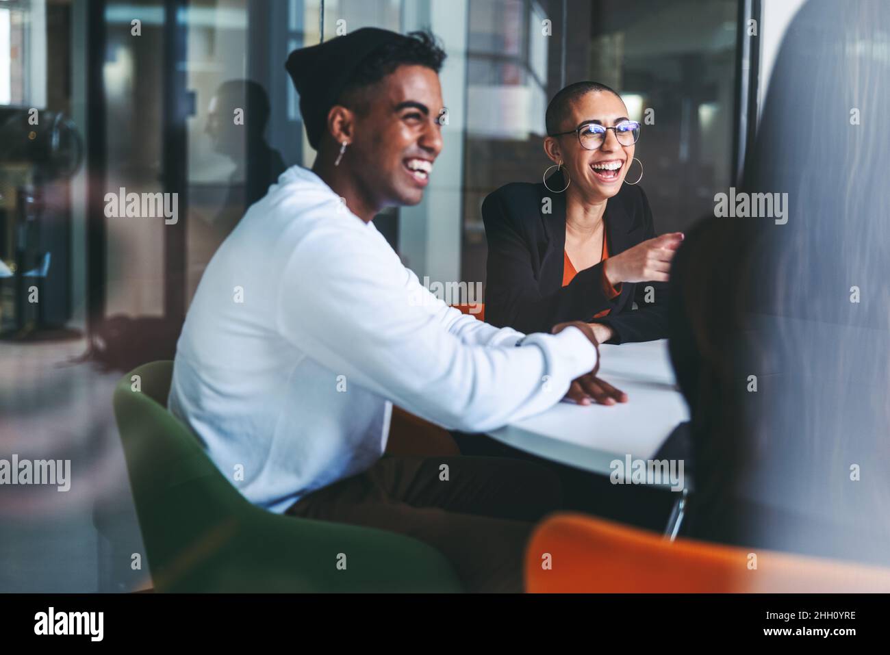 Laughter in the meeting room. Group of successful businesspeople ...