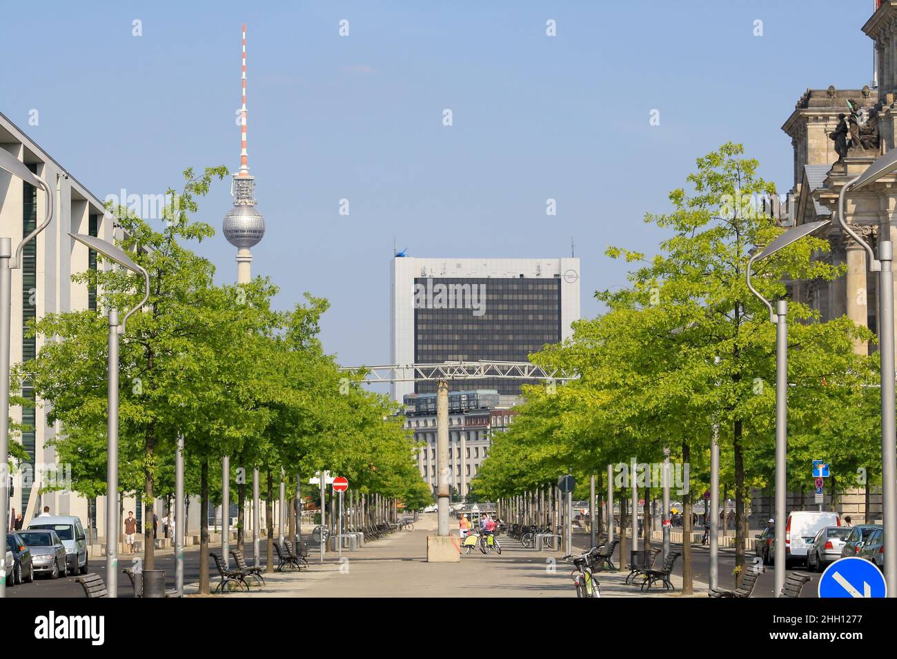 Perspective view of tree-lined street and park in Berlin, Germany with ...