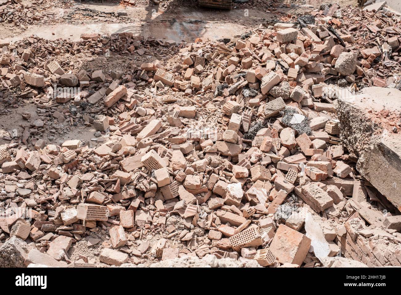 a heap of broken old bricks lying down after the demolition of a ...