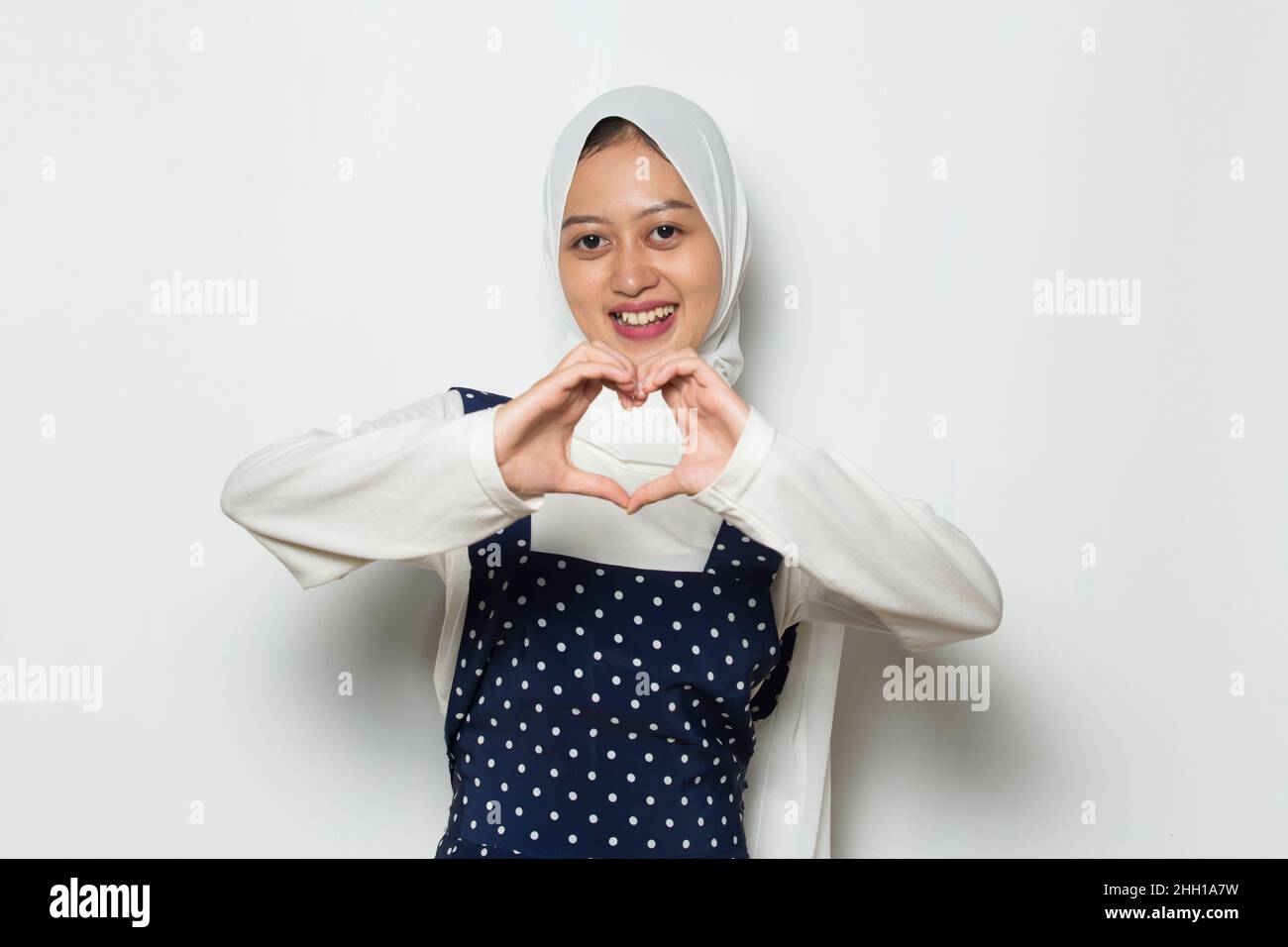 asian muslim woman wearing hijab showing heart sign Stock Photo - Alamy