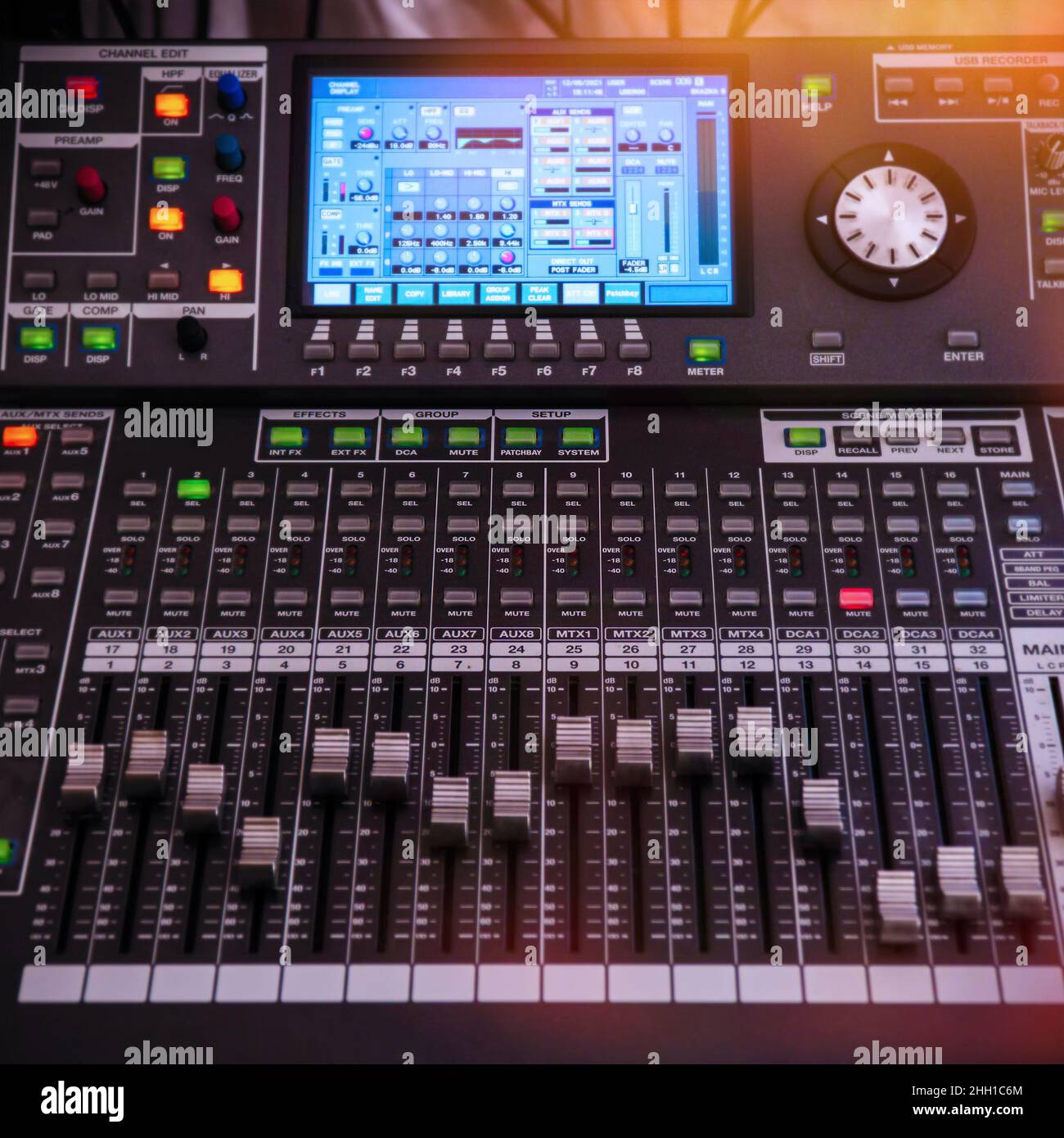 Modern digital mixing console with faders, control buttons and touch ...