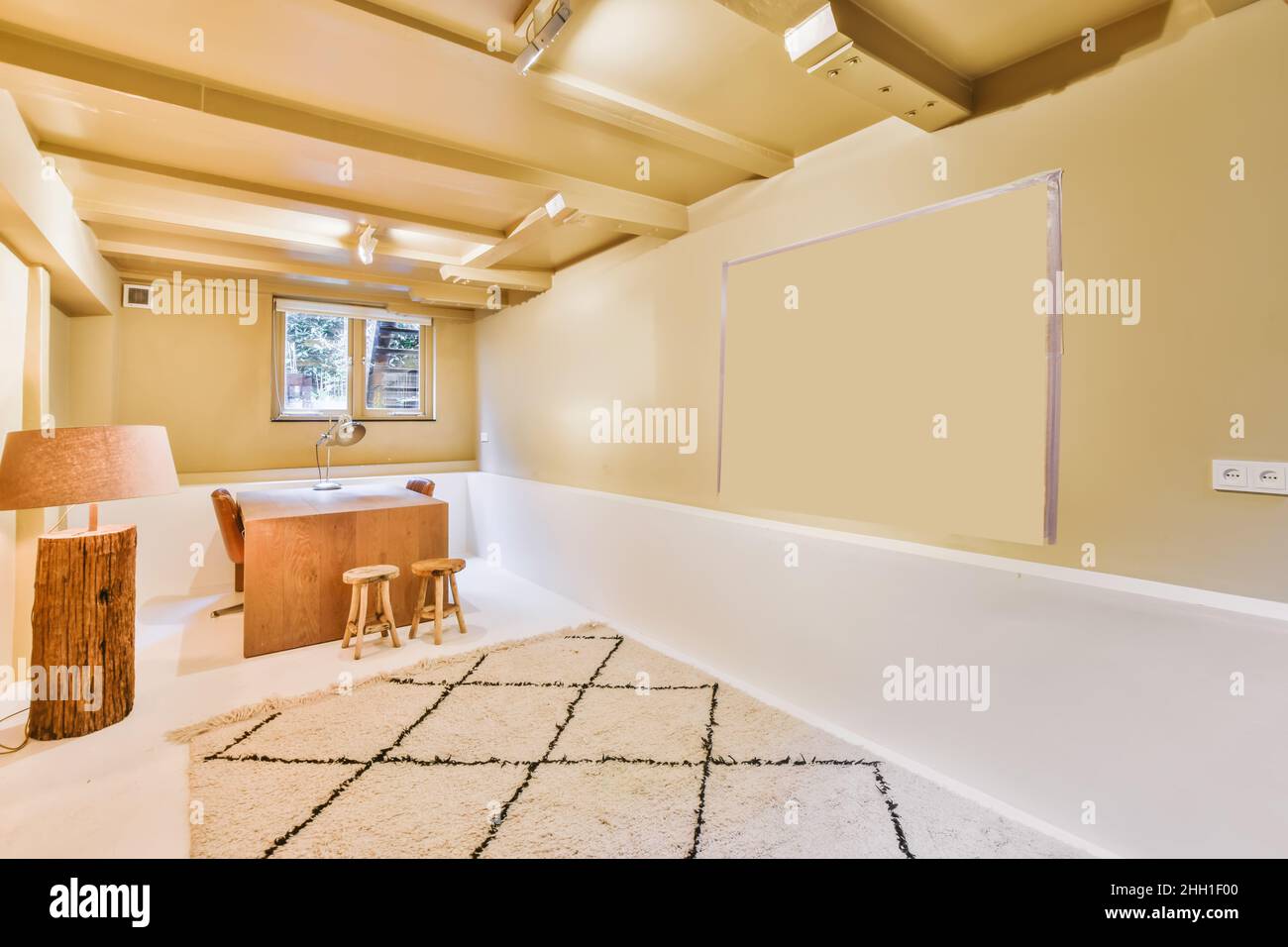 Amazing work room with wooden table and window on the wall Stock Photo ...