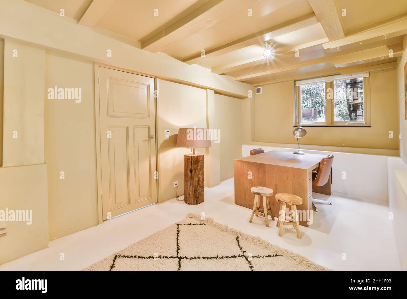 Amazing work room with wooden table and window on the wall Stock Photo ...