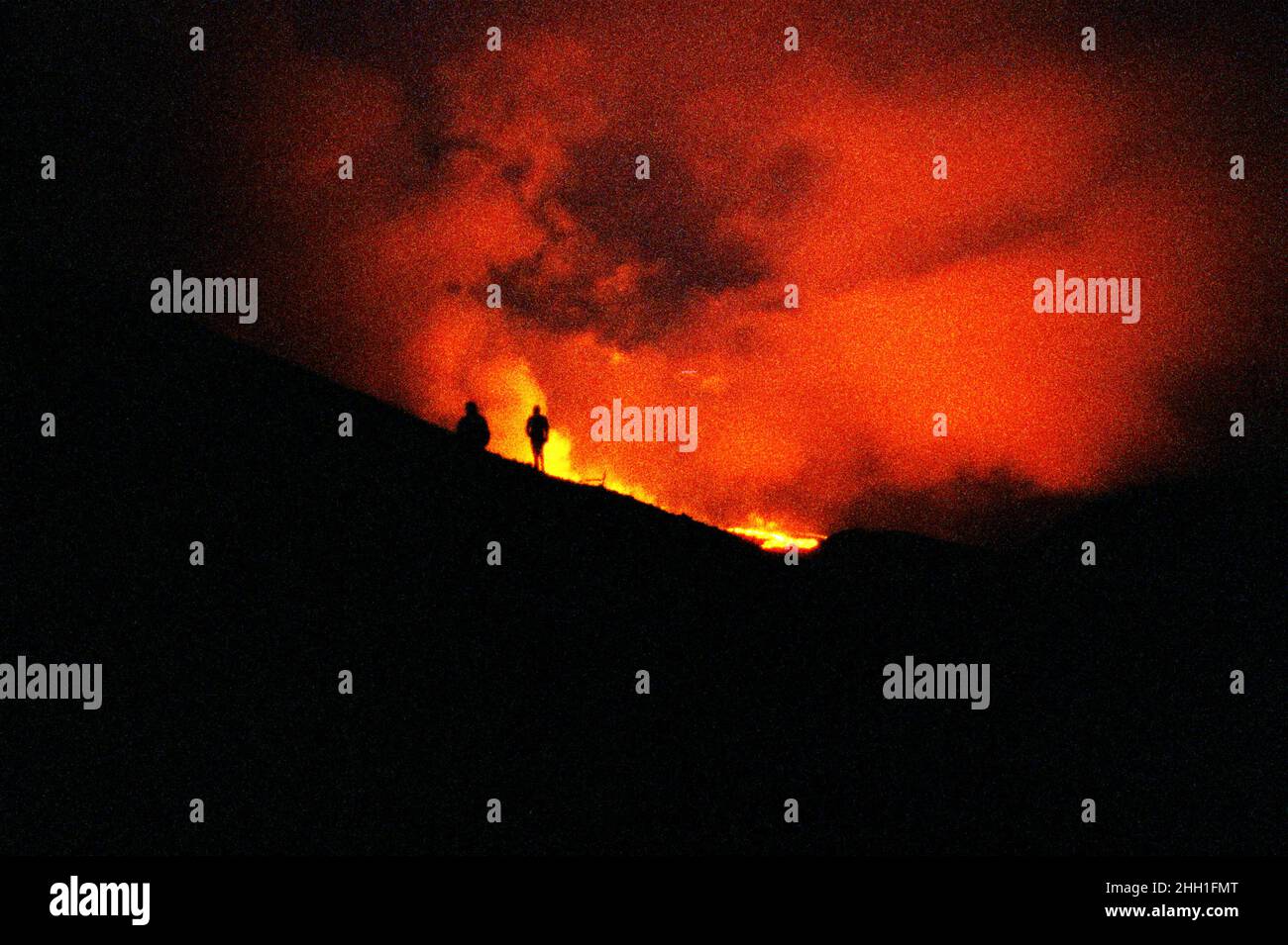 Volcano and people on fire Stock Photo - Alamy