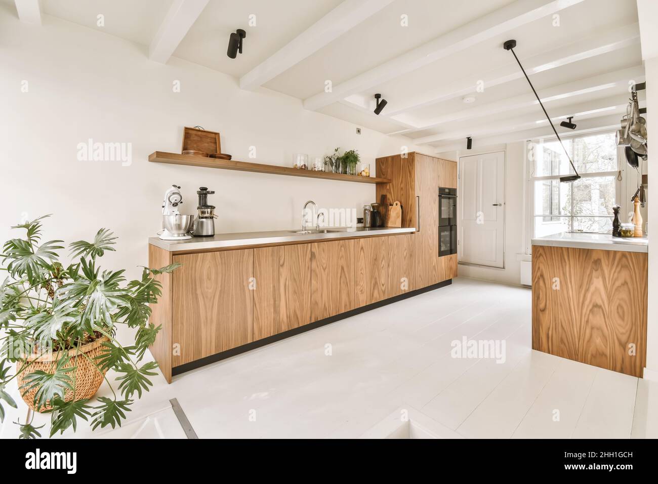 Luxurious and cozy kitchen with a light wooden kitchen set Stock Photo ...