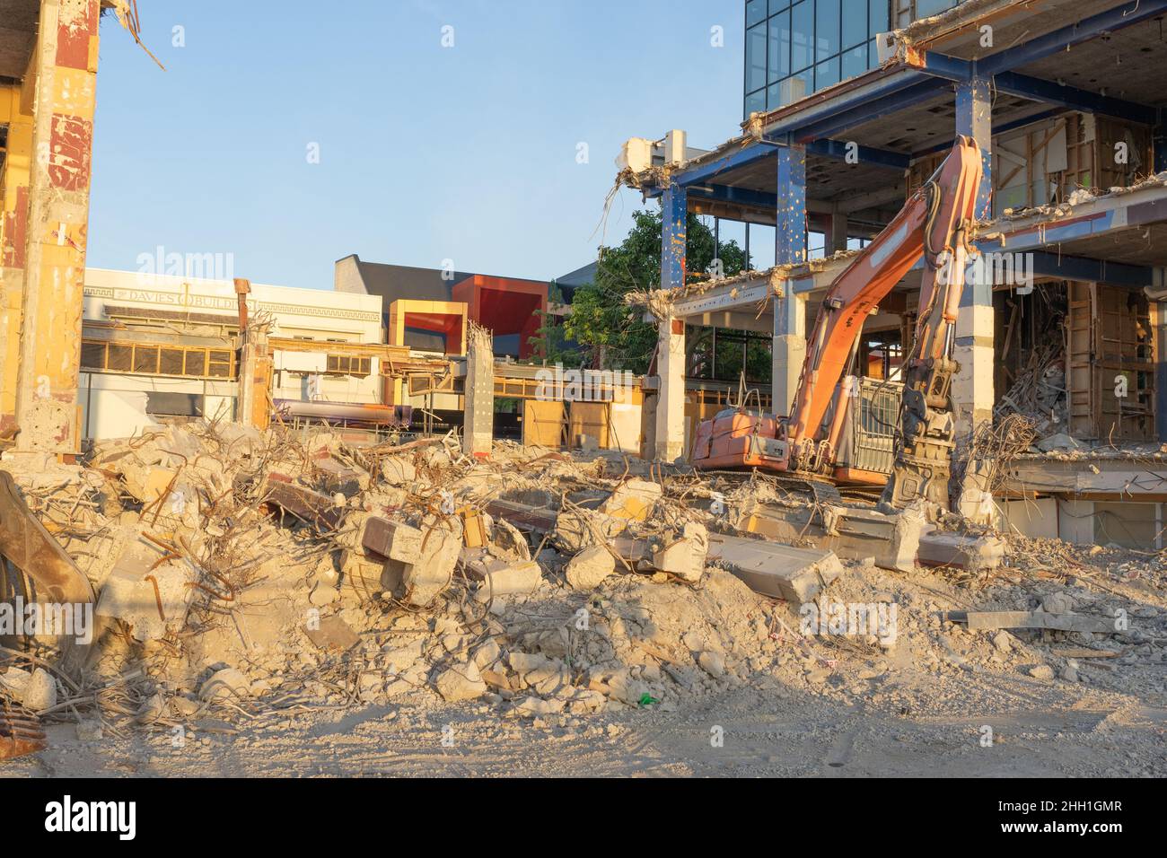 Building demolition site showing progressive destruction and clearing ...
