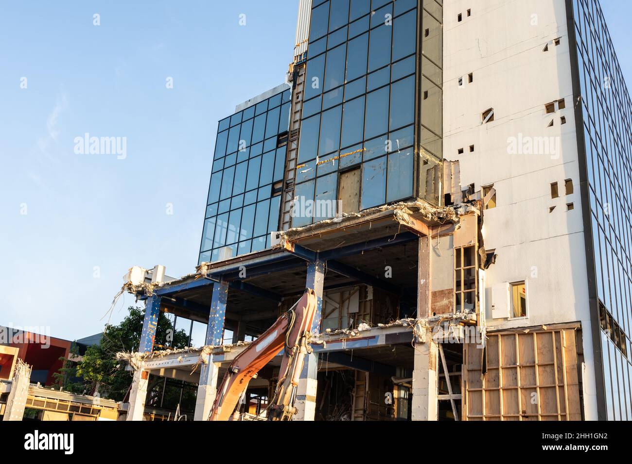 Building demolition site showing progressive destruction and clearing ...