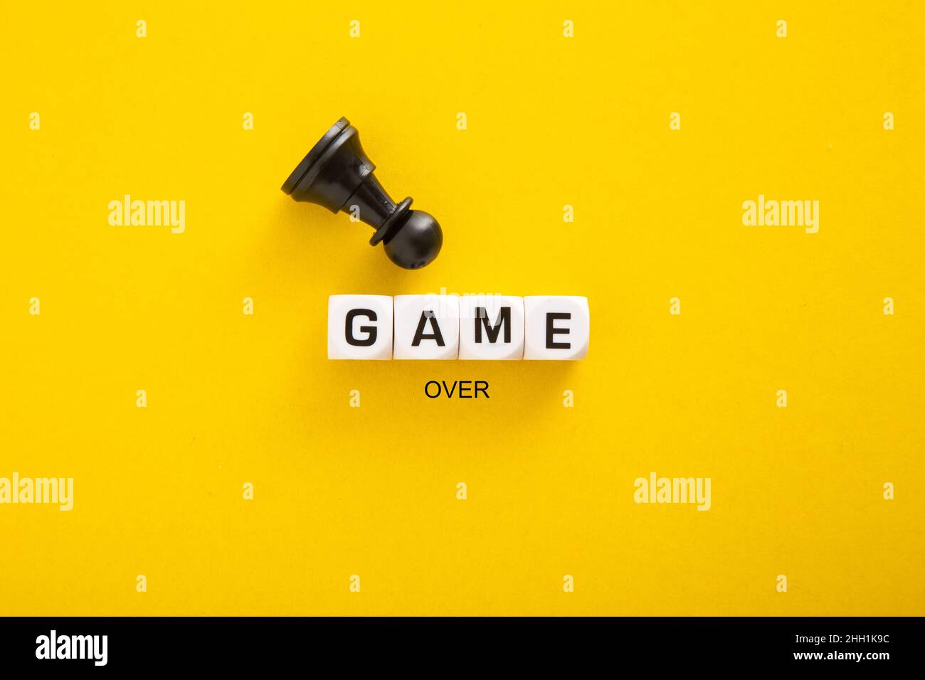 Game Over word and concept. Block letters on yellow background Stock ...