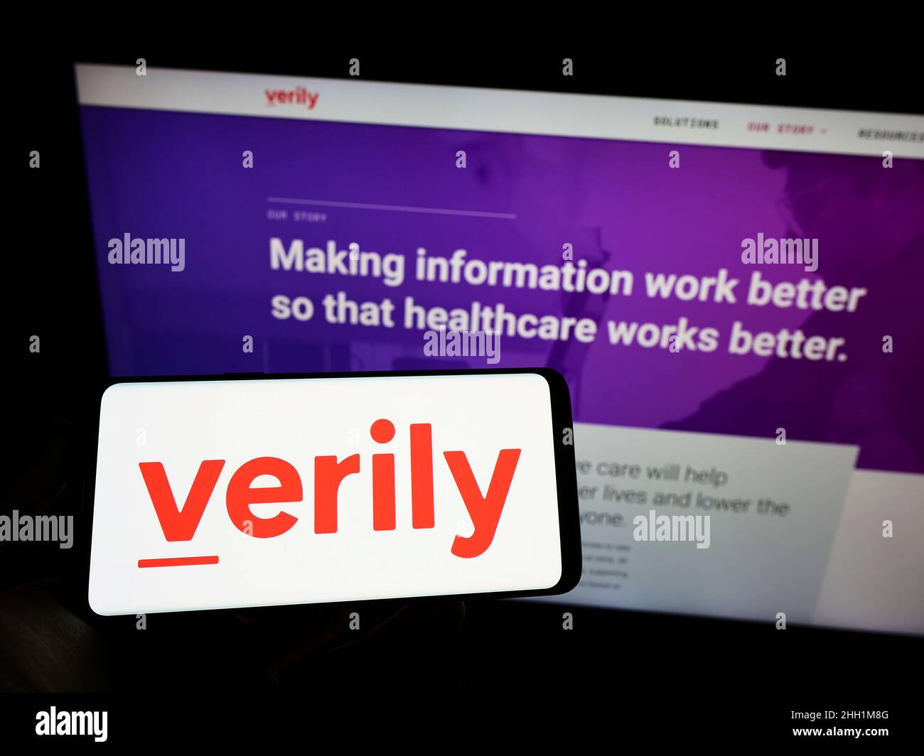 Person holding cellphone with logo of US research company Verily Life ...