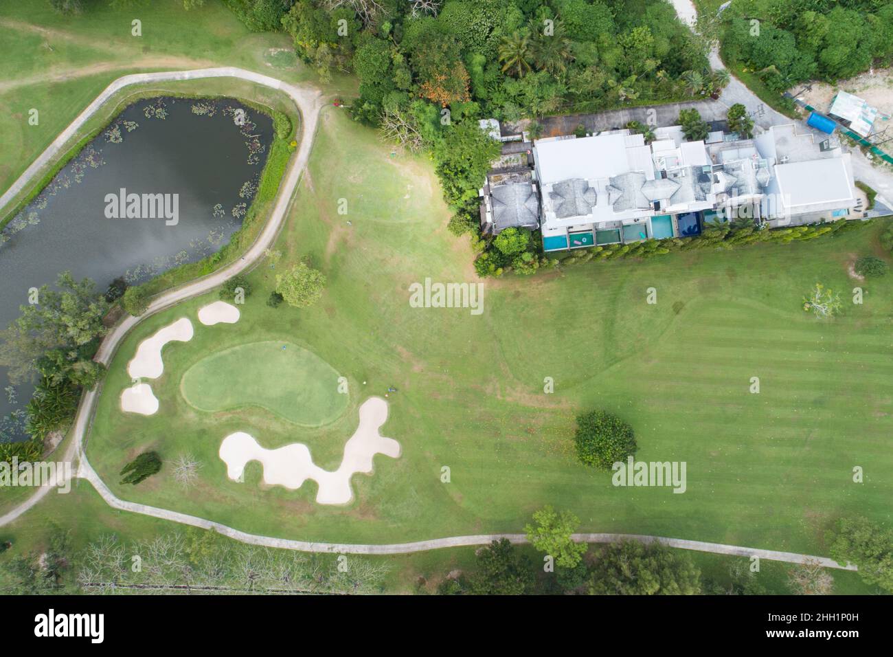 Aerial view drone shot of beautiful green golf field fairway and ...