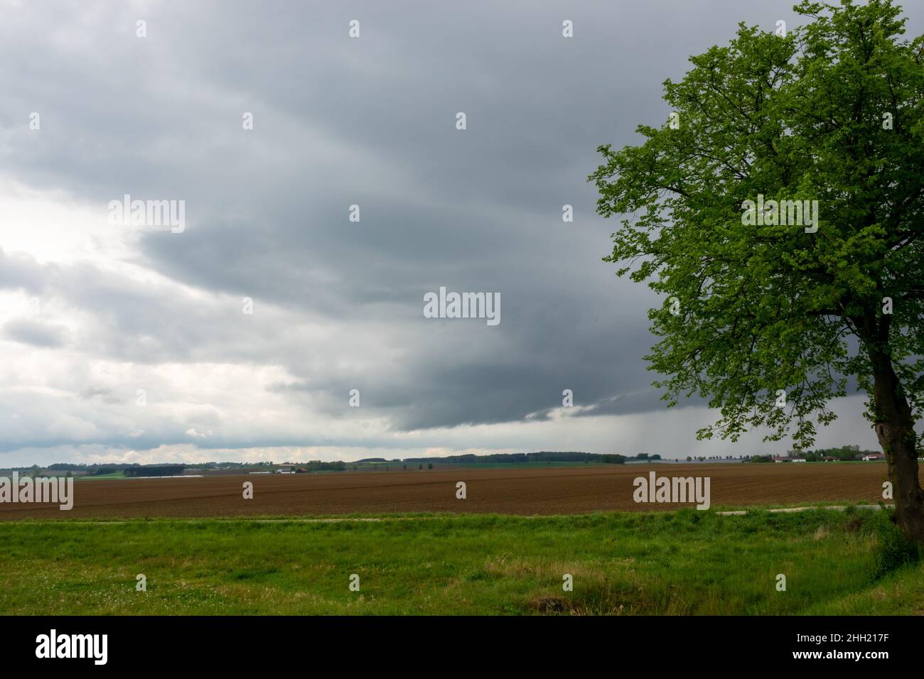 Stormy Clouds Over Farm Field Stock Photo - Alamy
