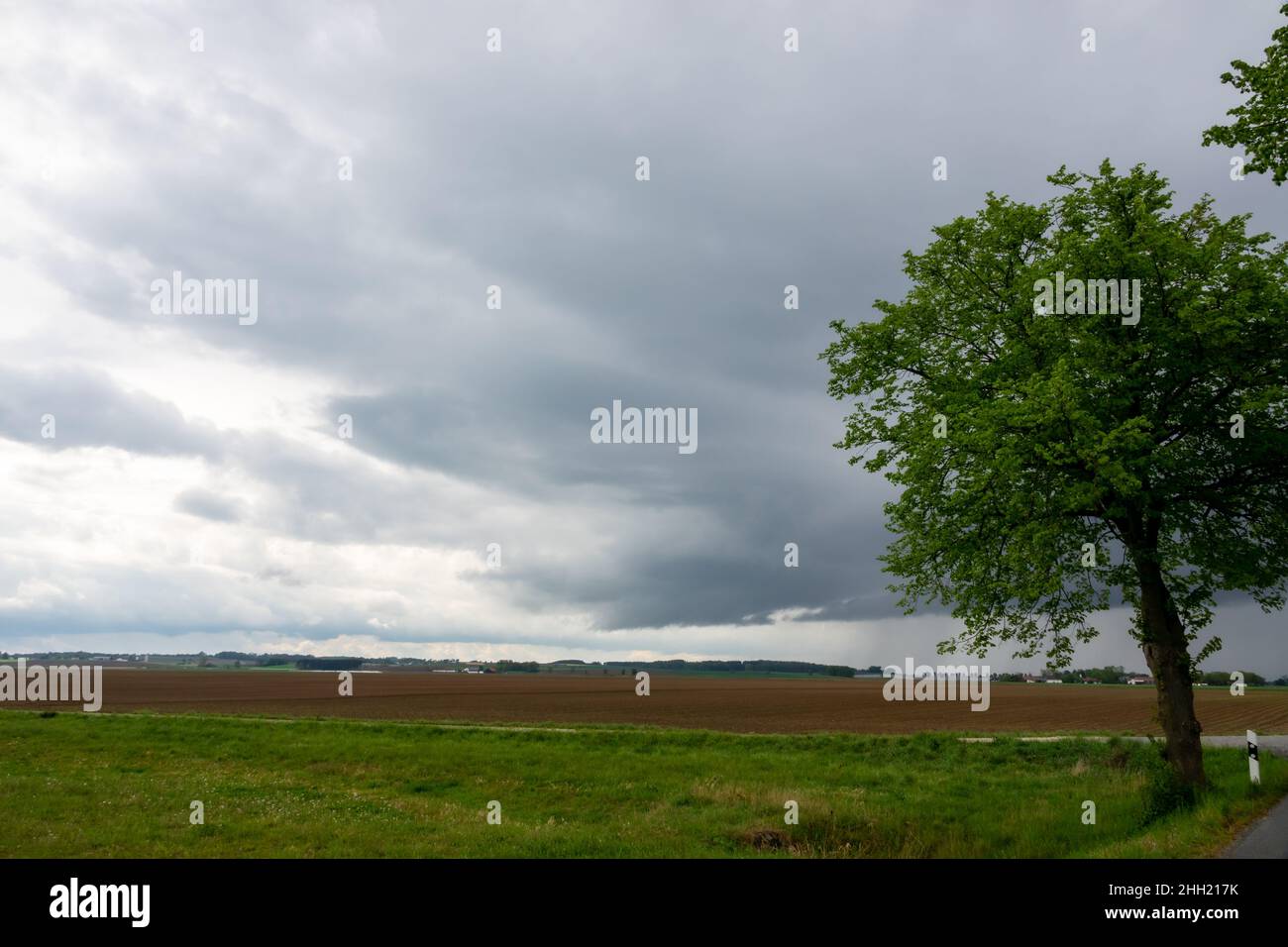 Stormy Clouds Over Farm Field Stock Photo - Alamy