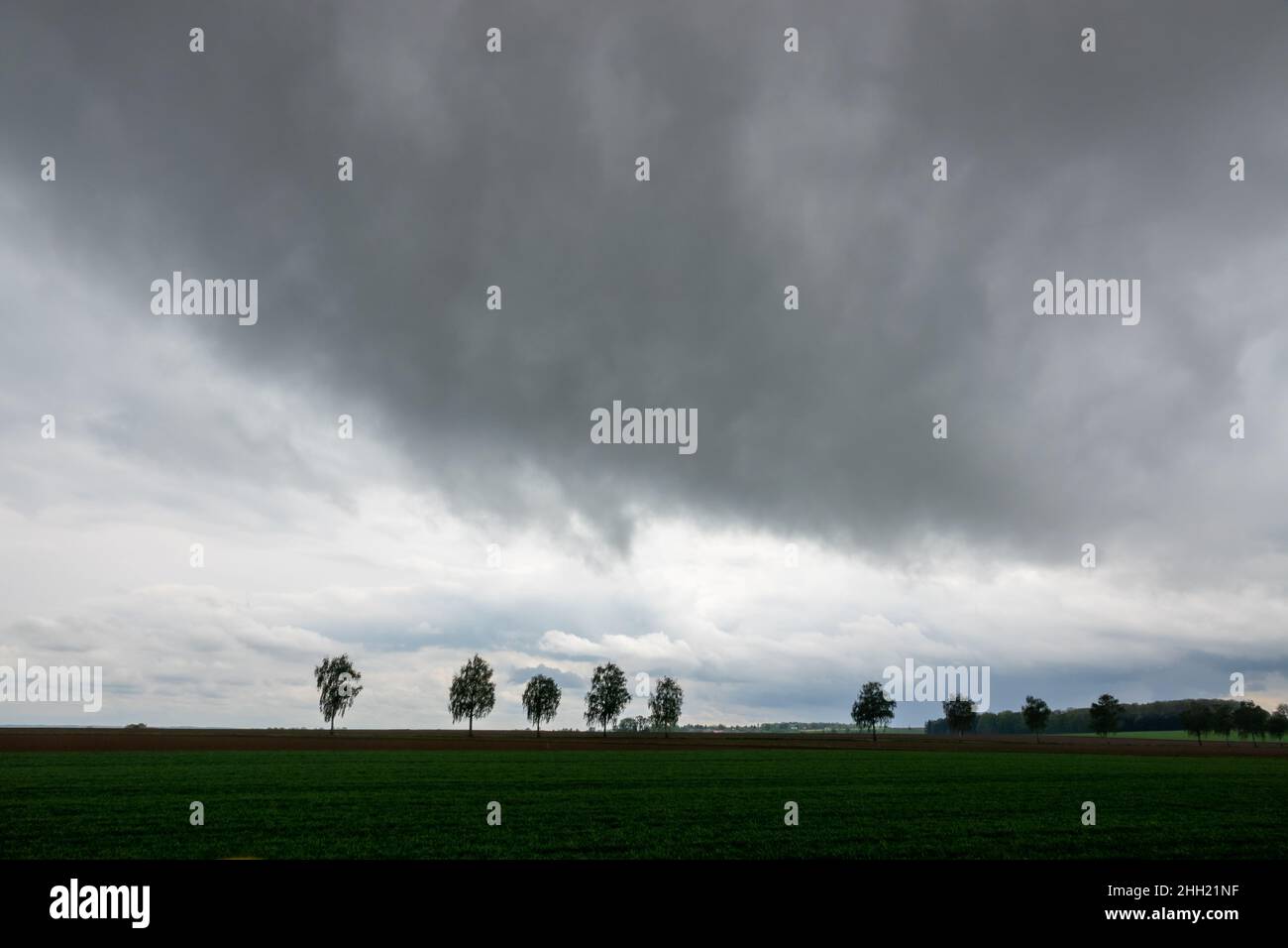 Stormy Clouds Over Farm Field Stock Photo - Alamy