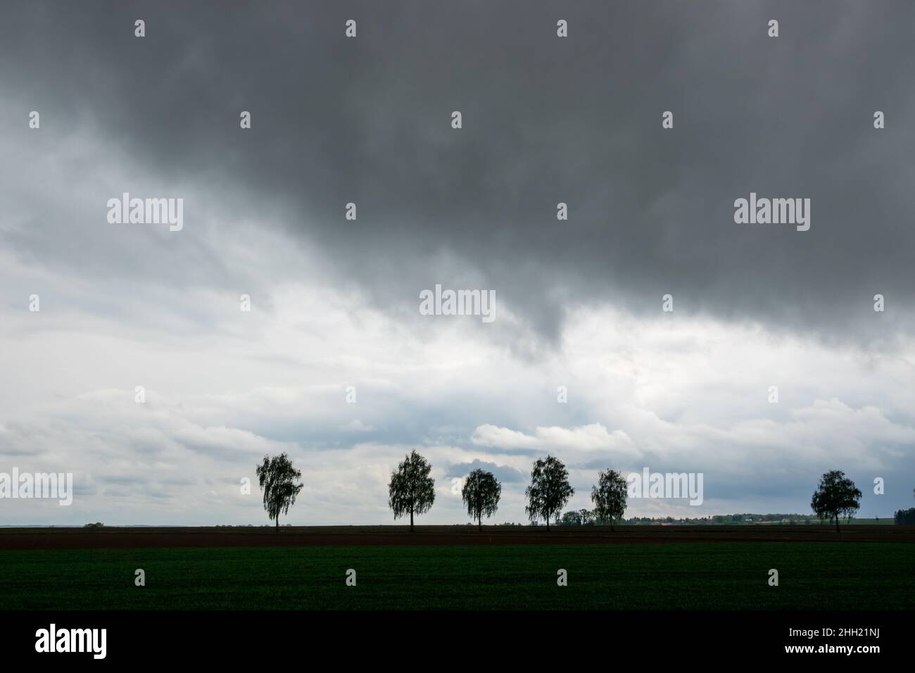 Stormy Clouds Over Farm Field Stock Photo - Alamy