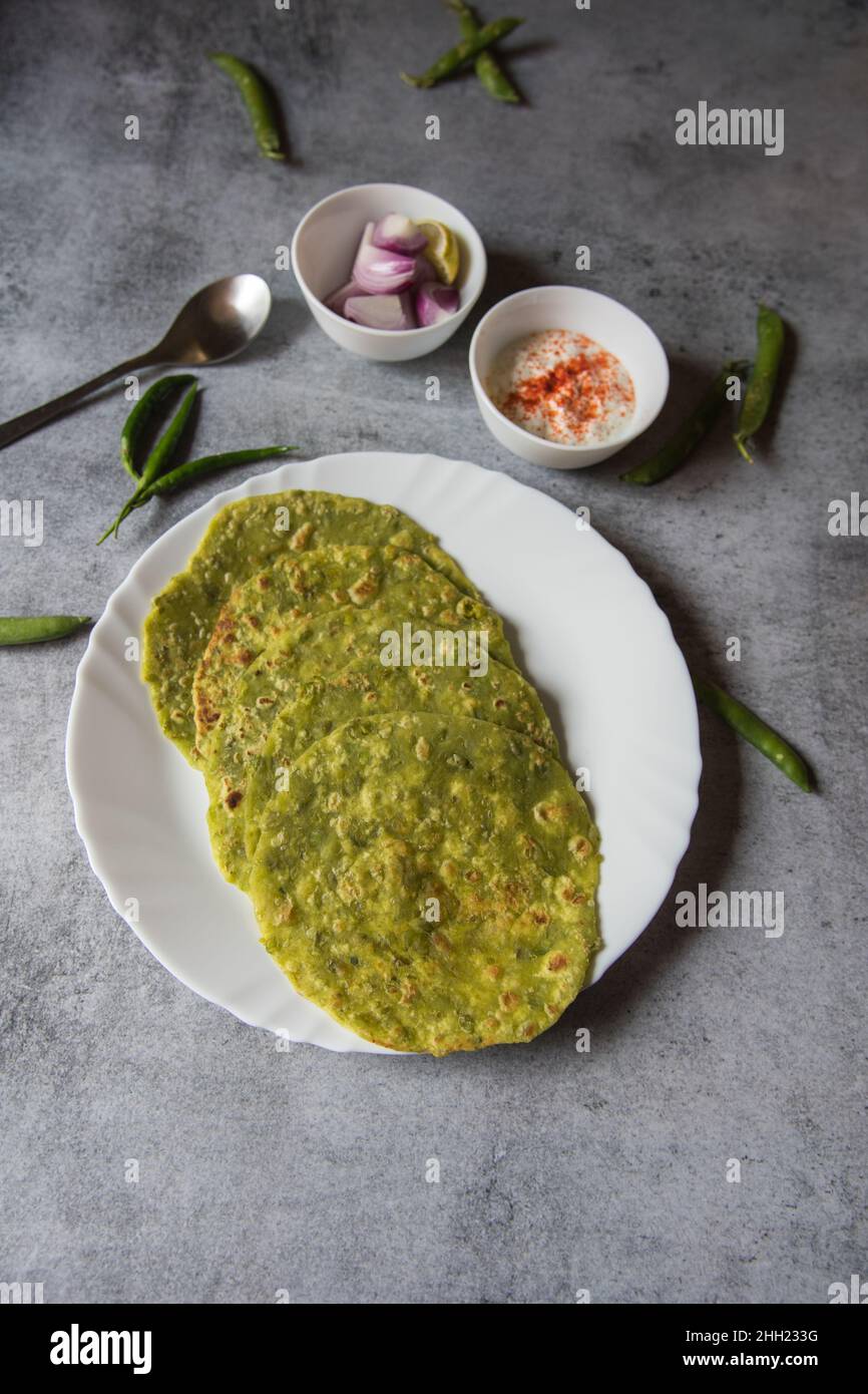 Green peas stuffed Indian flat bread or matar ka paratha served. Close ...