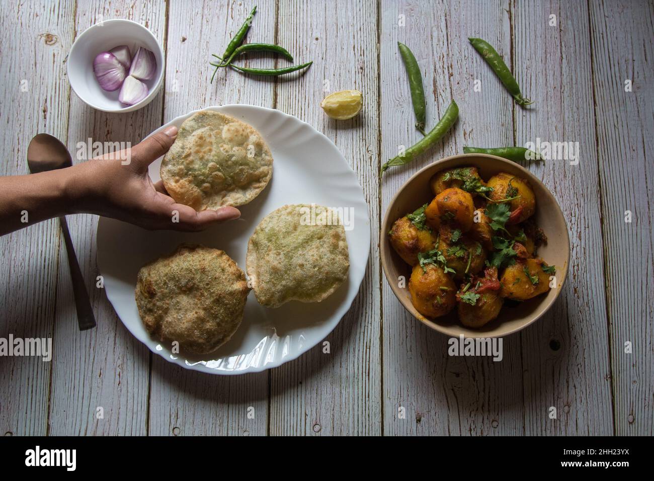 Hand of a lady serving food with use of selective focus Stock Photo - Alamy