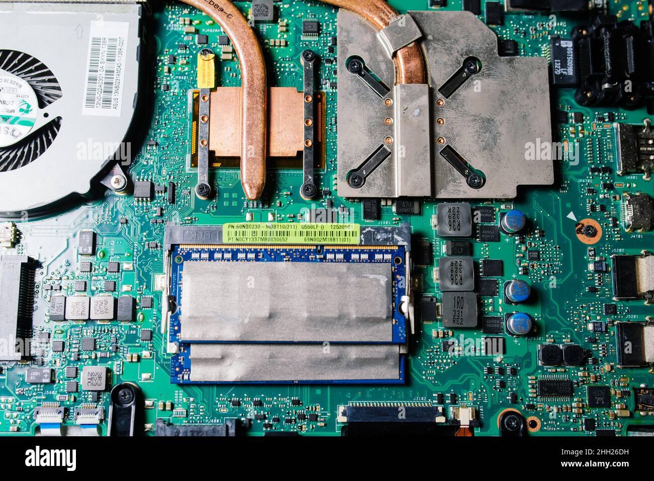 Service engineer install new chips to laptop. Repairing and upgrading ...