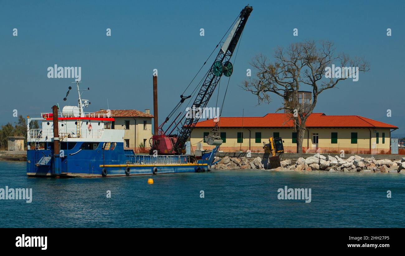 Maintenance of the coast in the lagoon at Grado,Italy,Europe Stock ...