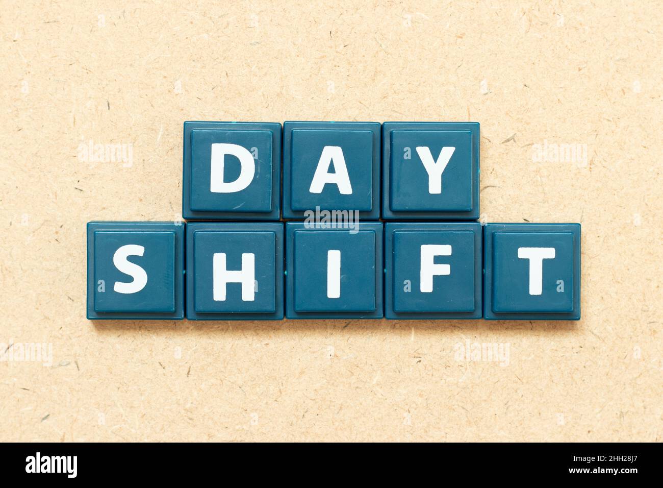 Tile alphabet letter in word day shift on wood background Stock Photo ...