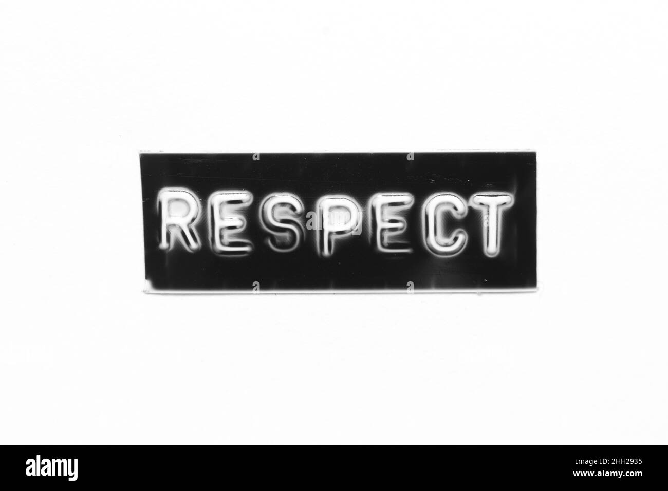 Black color banner that have embossed letter with word respect on white ...