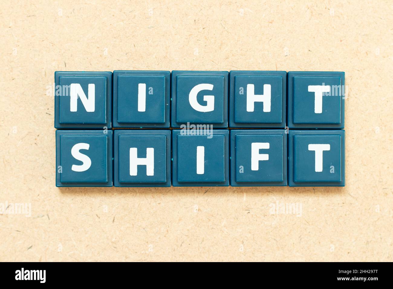 Tile alphabet letter in word night shift on wood background Stock Photo ...