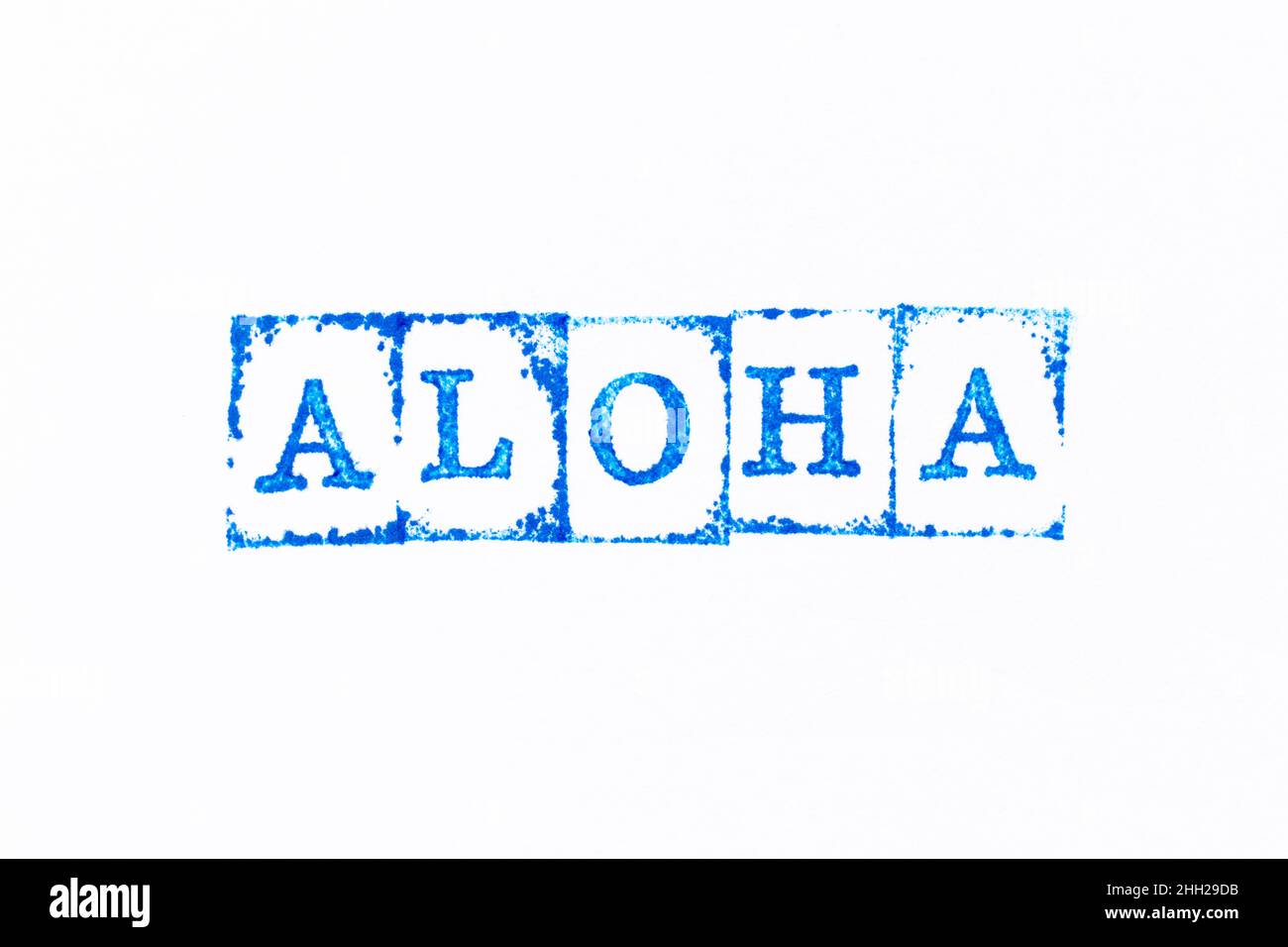 Blue color ink rubber stamp in word aloha on white paper background ...