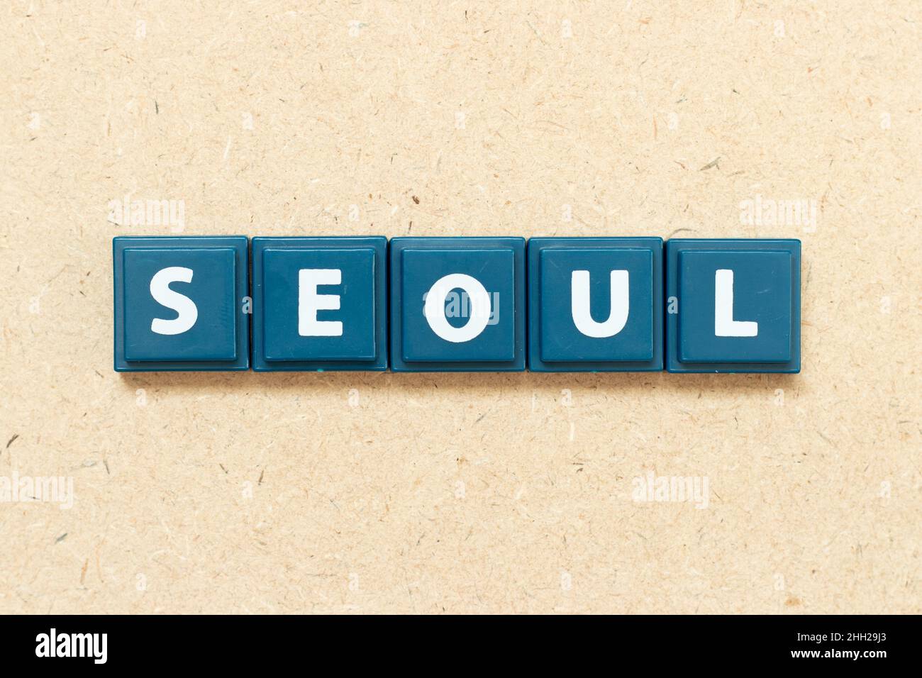 Tile alphabet letter in word seoul on wood background Stock Photo - Alamy