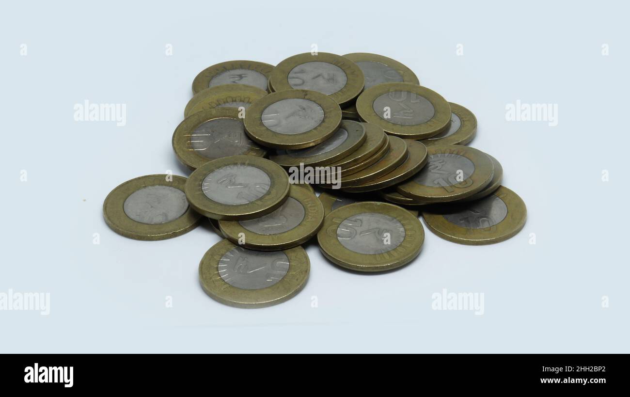 Pile of Indian Rupee Coins. Ten rupee coins. On a white background ...