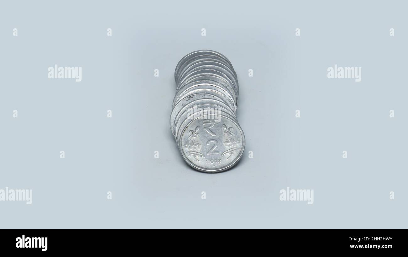 Pile of Indian Rupee Coins. Two rupee coins. On a white background ...